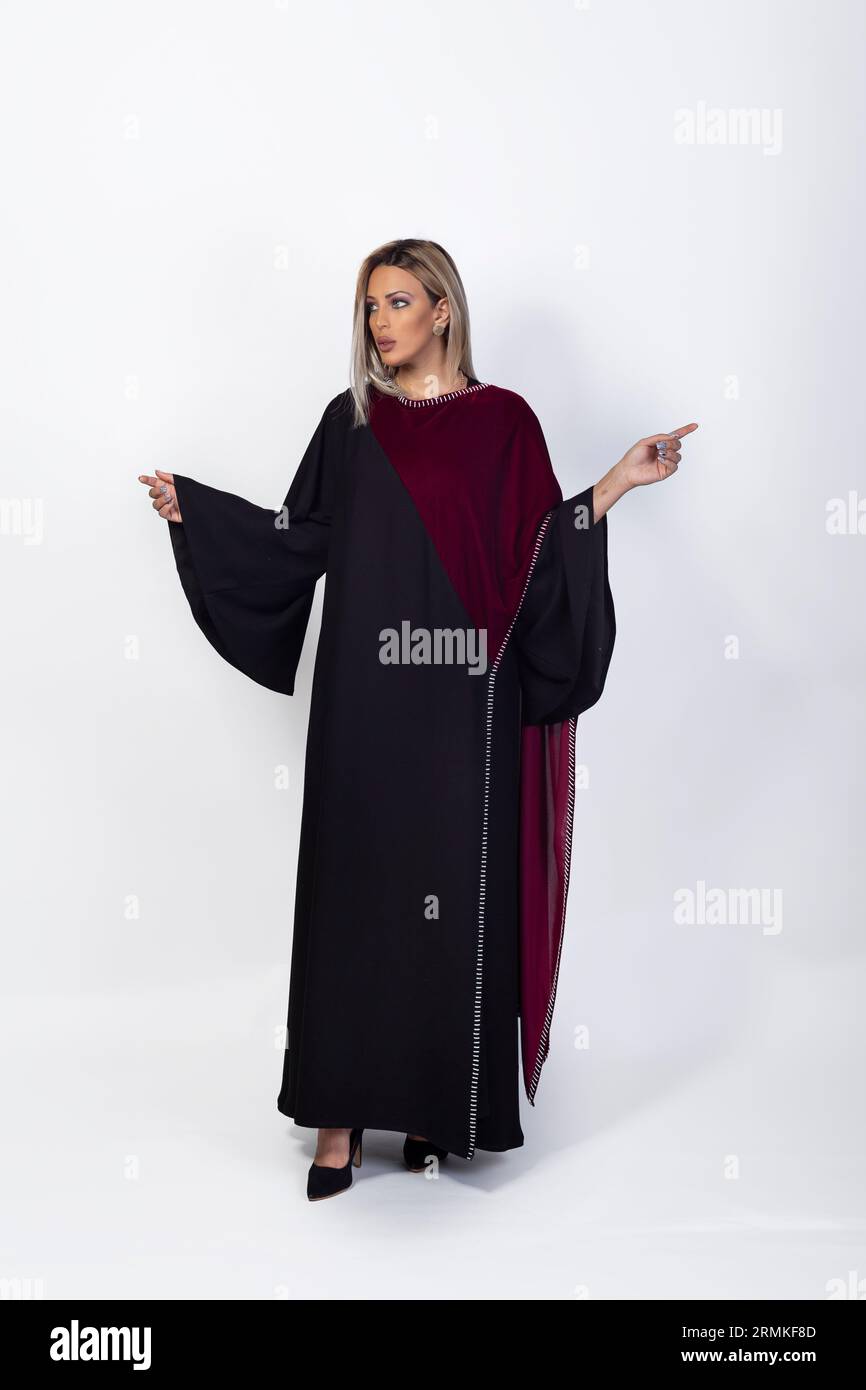 Asian Model poses for Arabic designer Abaya on isolated background ...