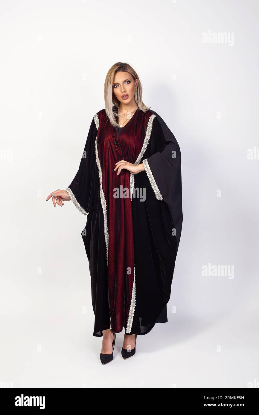 Asian Model poses for Arabic designer Abaya on isolated background ...