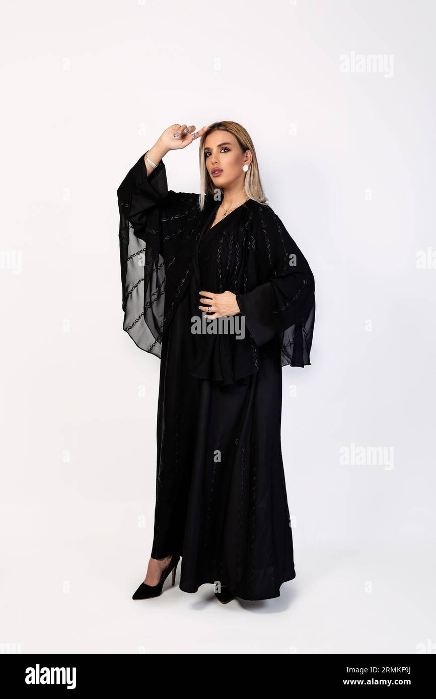 Asian Model poses for Arabic designer Abaya on isolated background ...
