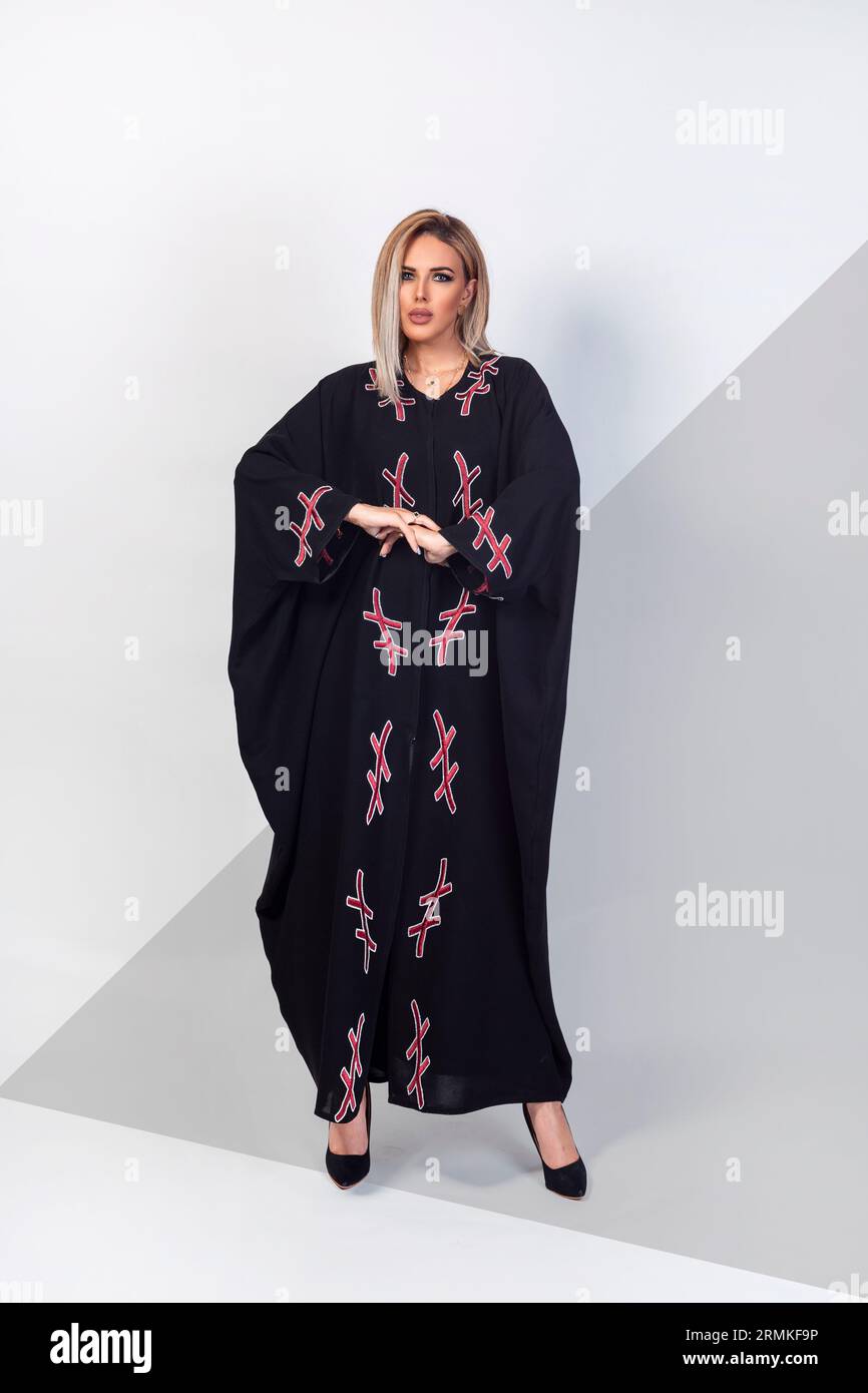Asian Model poses for Arabic designer Abaya on isolated background ...