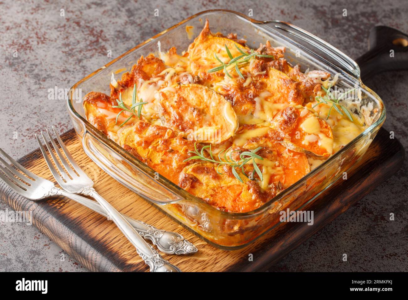 Vegetarian food sweet potato casserole close-up in a glass baking dish ...