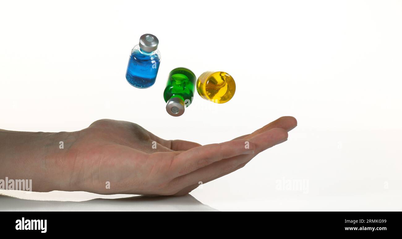 Medical Product Falling into Hand against White Background Stock Photo ...