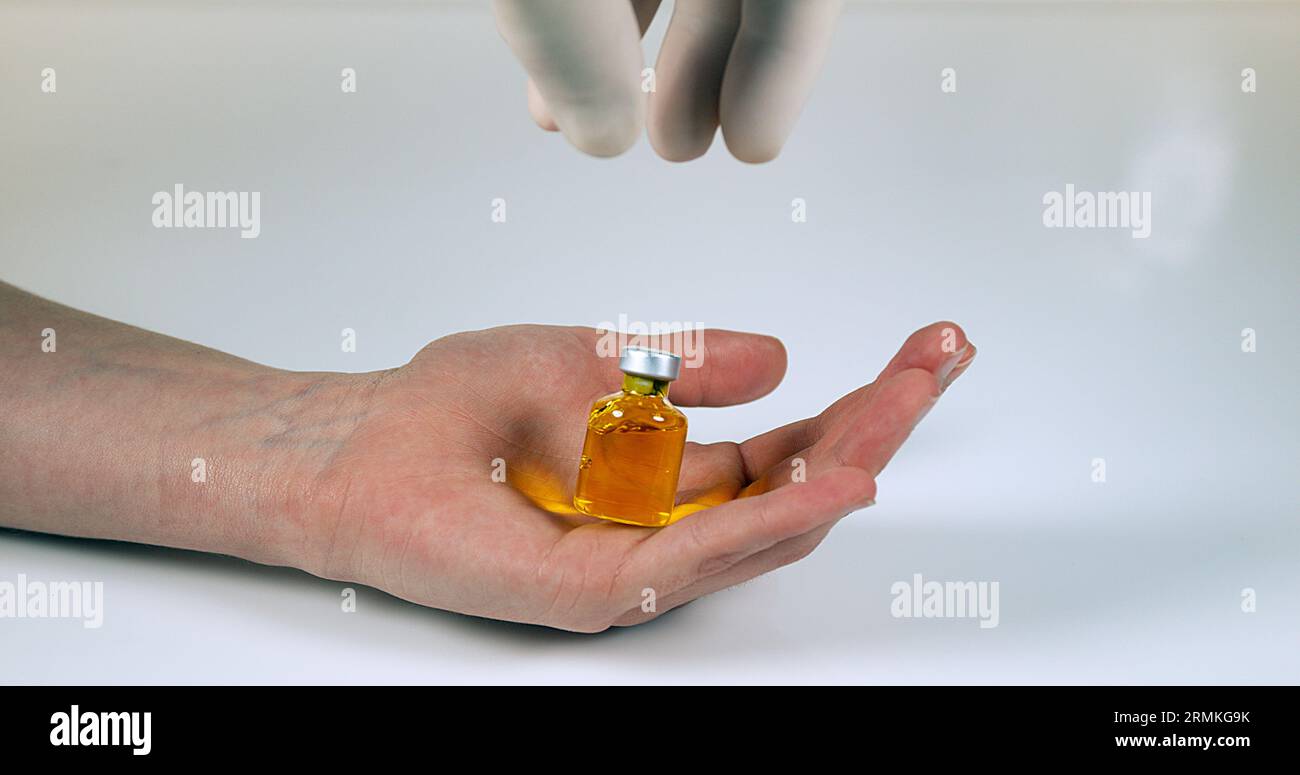 Medical Product Falling into Hand against White Background Stock Photo ...