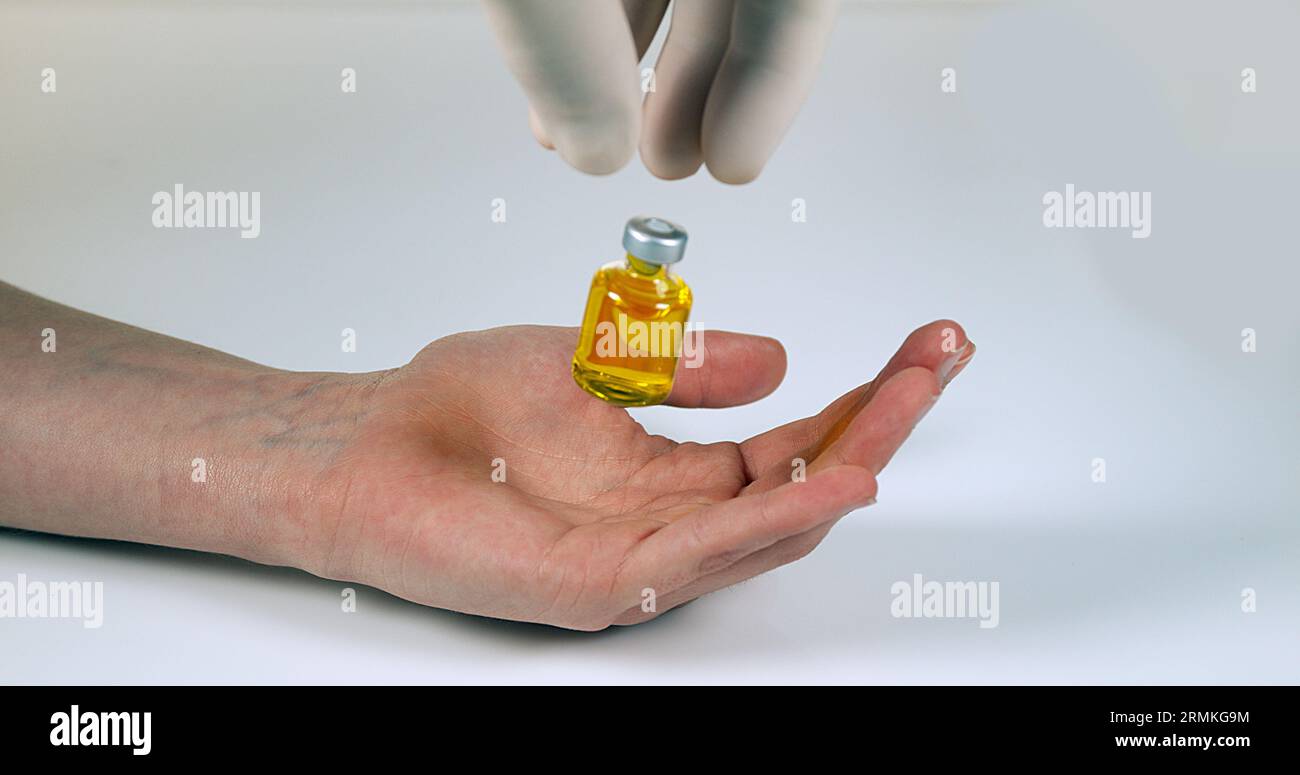 Medical Product Falling into Hand against White Background Stock Photo ...