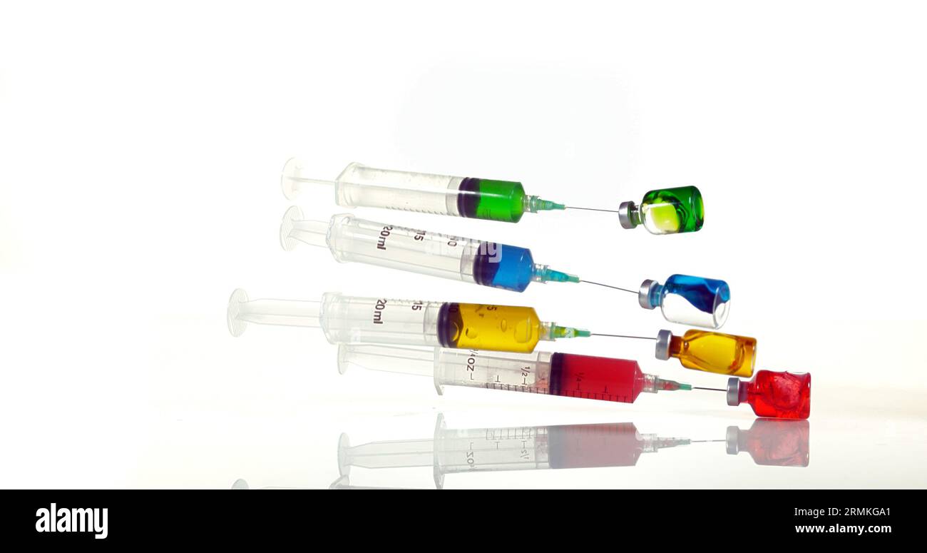 Syringe Falling against White Background Stock Photo - Alamy