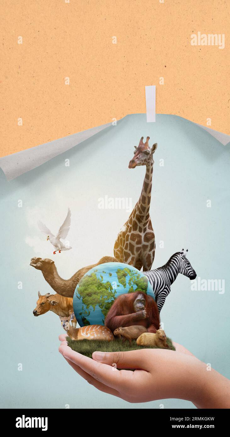 Human hand showing wildlife animal and earth. World Animal Day concept ...