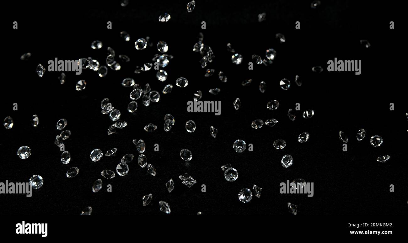 Diamonds falling against Black Background Stock Photo - Alamy