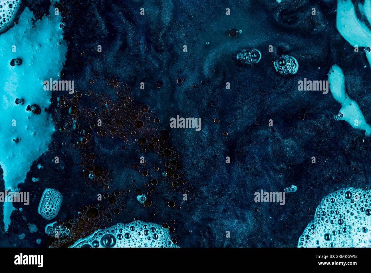Blue liquid with black blobs Stock Photo - Alamy