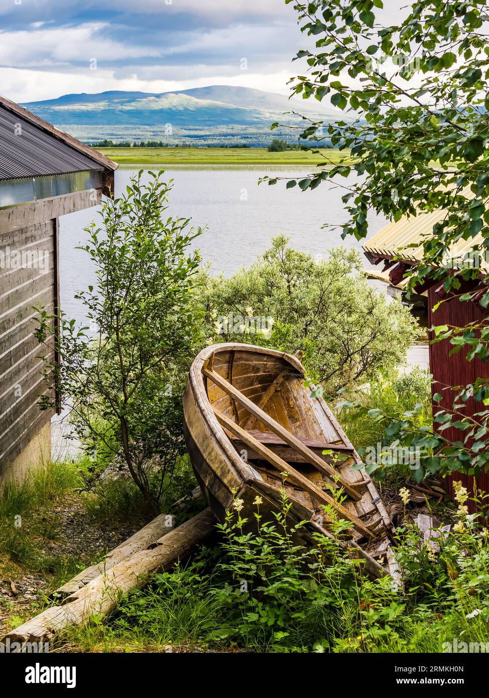 Serene day in rural Sweden: boat house, lake, trees, peaceful water ...