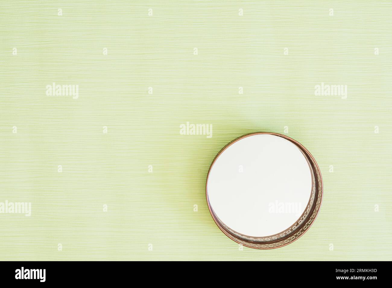 Circular glass mirror mint green background Stock Photo - Alamy