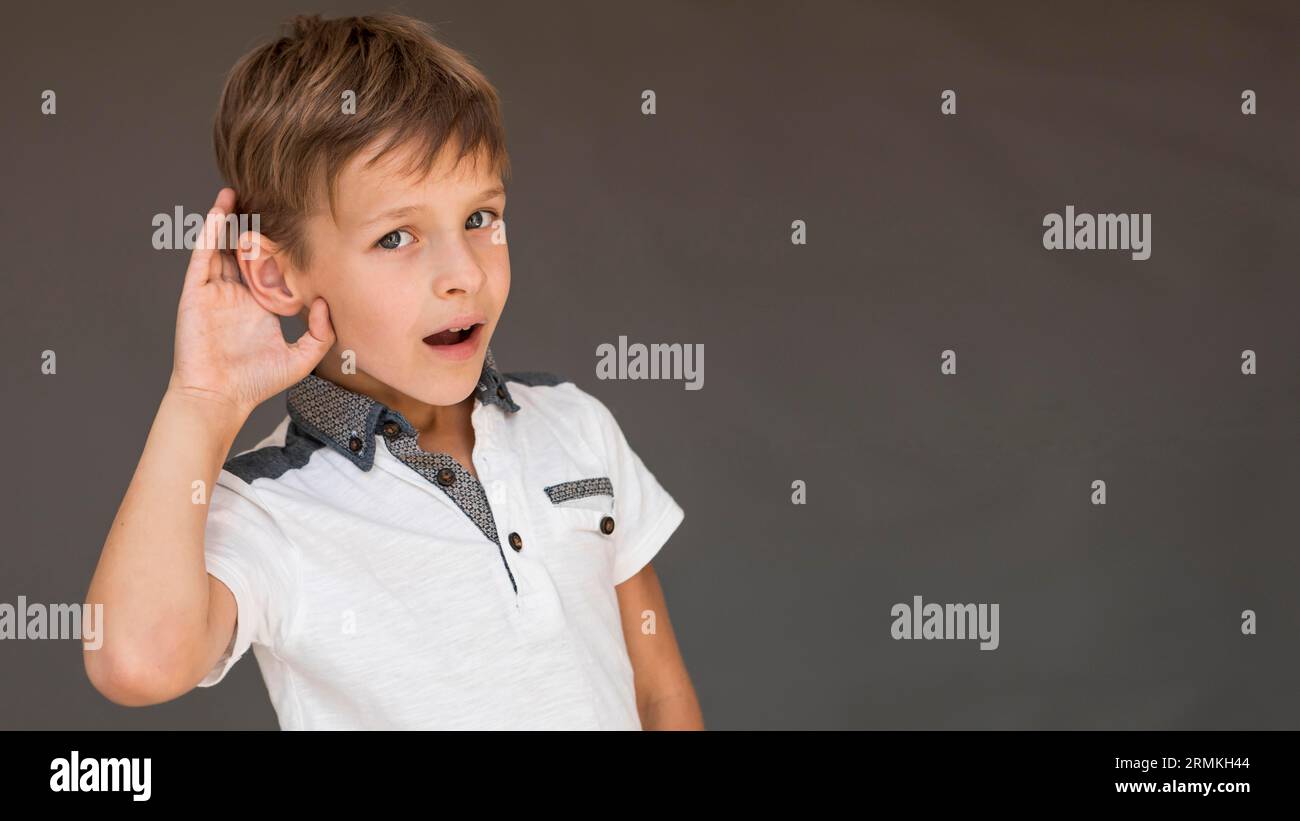 Boy looking curious with copy space Stock Photo - Alamy