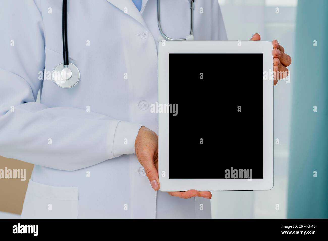 Close up doctor holding tablet mock up Stock Photo - Alamy