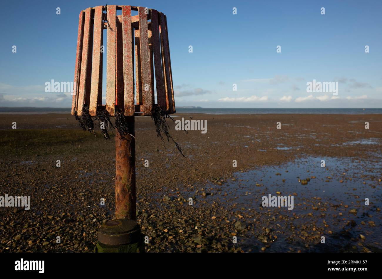 Faded red high tide maker on a beach in Whitstable Kent UK Stock Photo ...