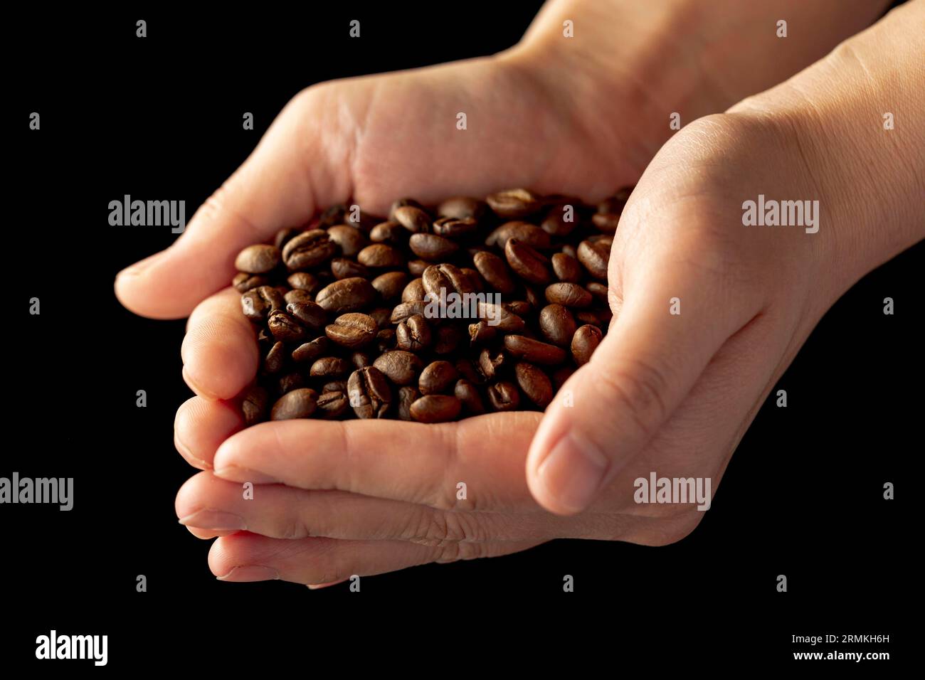 Coffee beans mans hands Stock Photo - Alamy