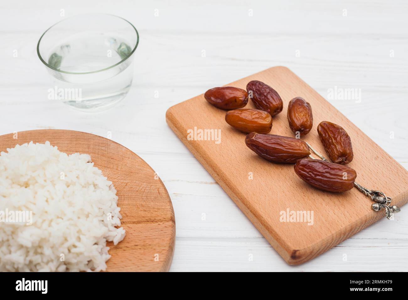 Cooked rice with dates fruit board Stock Photo - Alamy