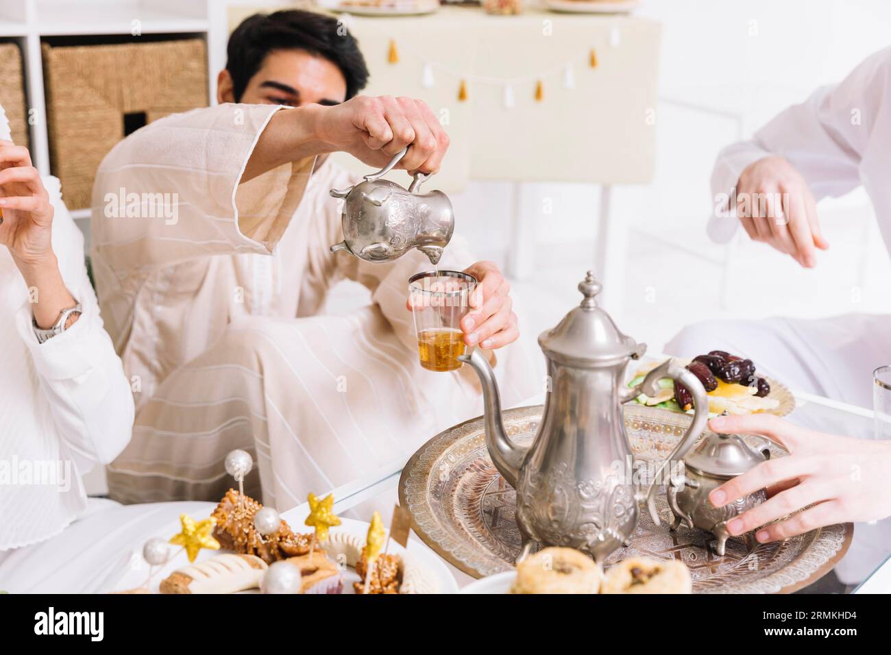 Eid al fitr concept with tea friends Stock Photo - Alamy