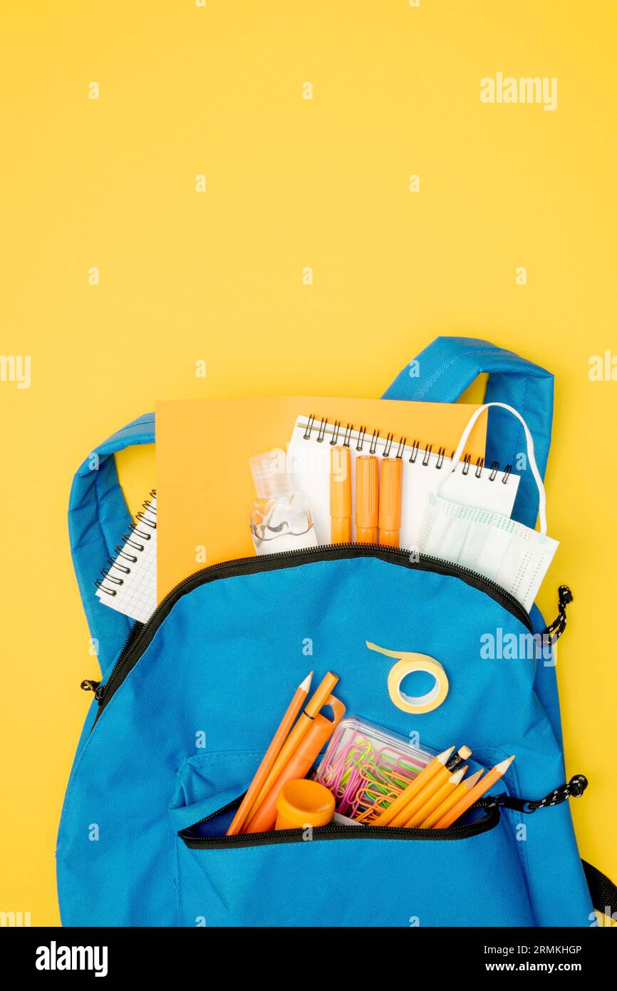 Flat lay backpack with school supplies Stock Photo - Alamy