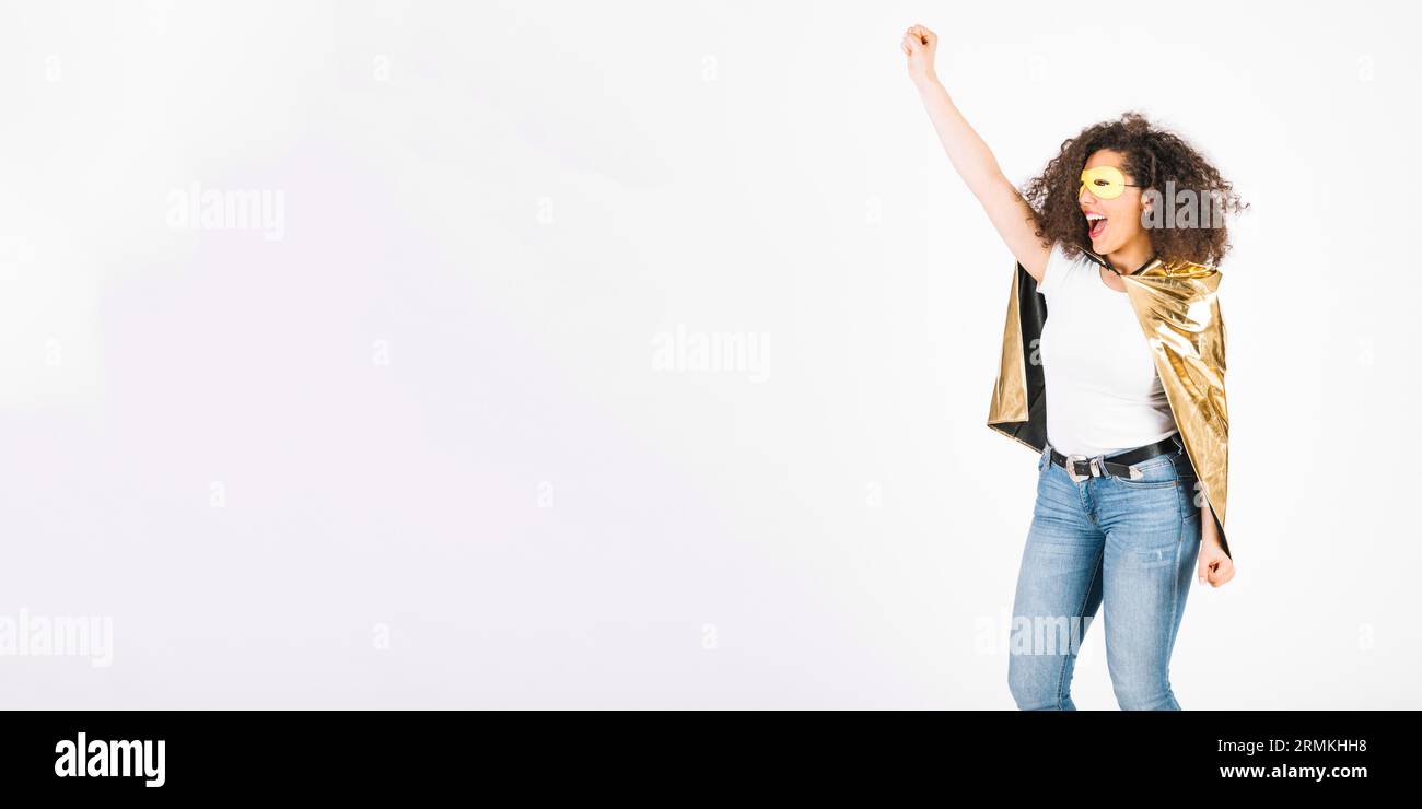 Excited brunette superhero costume Stock Photo - Alamy