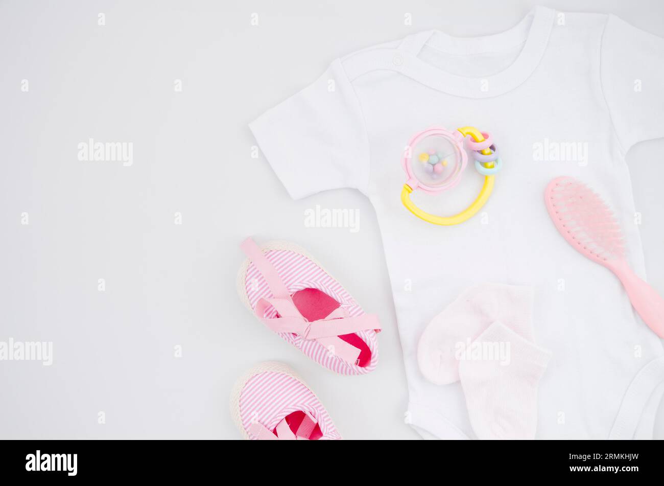 Flat lay baby clothes with white background Stock Photo - Alamy