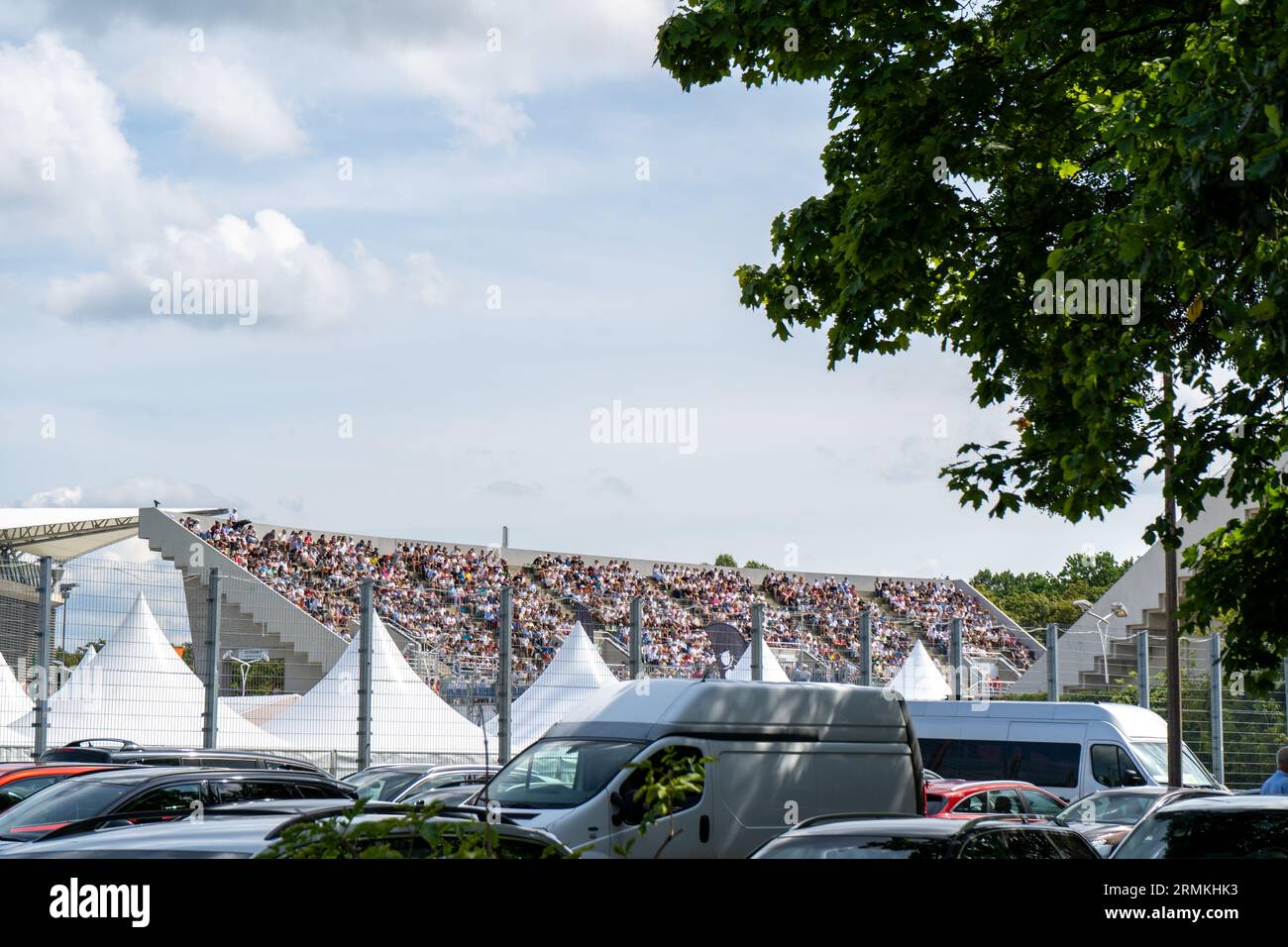 Tribune of the stadium. Crowded stands. Spectators in the open stadium ...