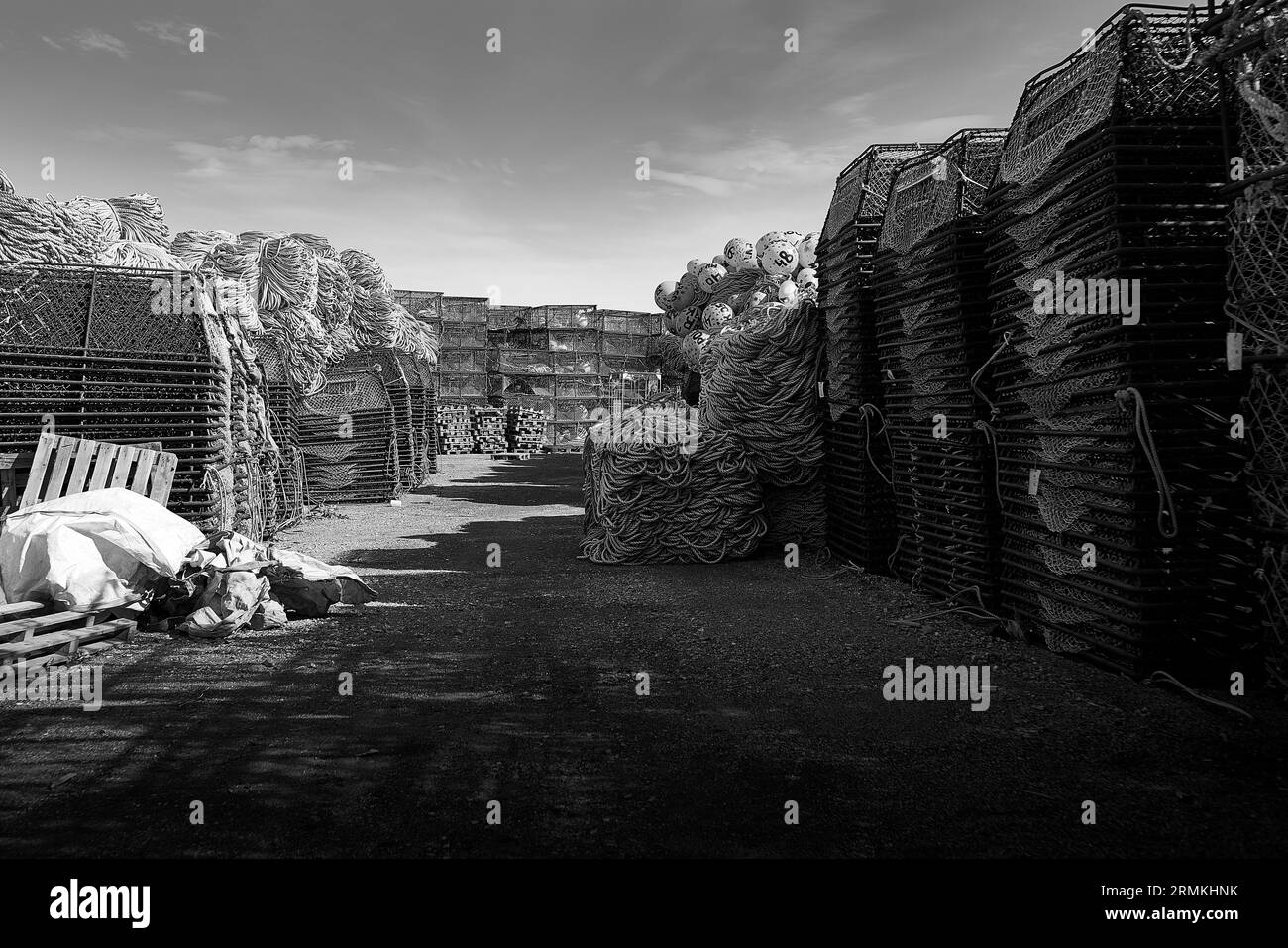 Black And White Photo Of Stacks Of Crab Traps In The Norwegian Arctic ...
