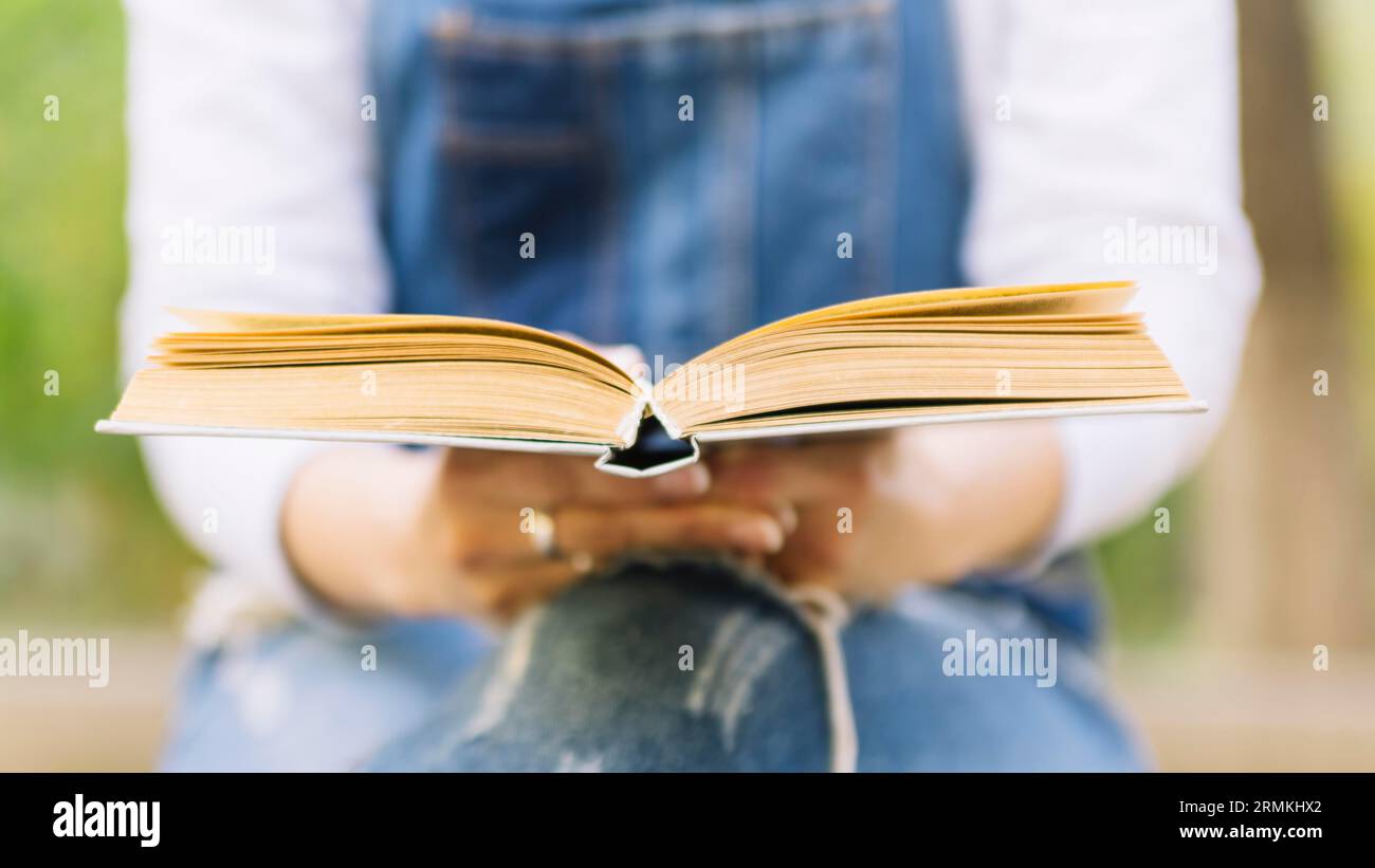 Front view person reading Stock Photo - Alamy