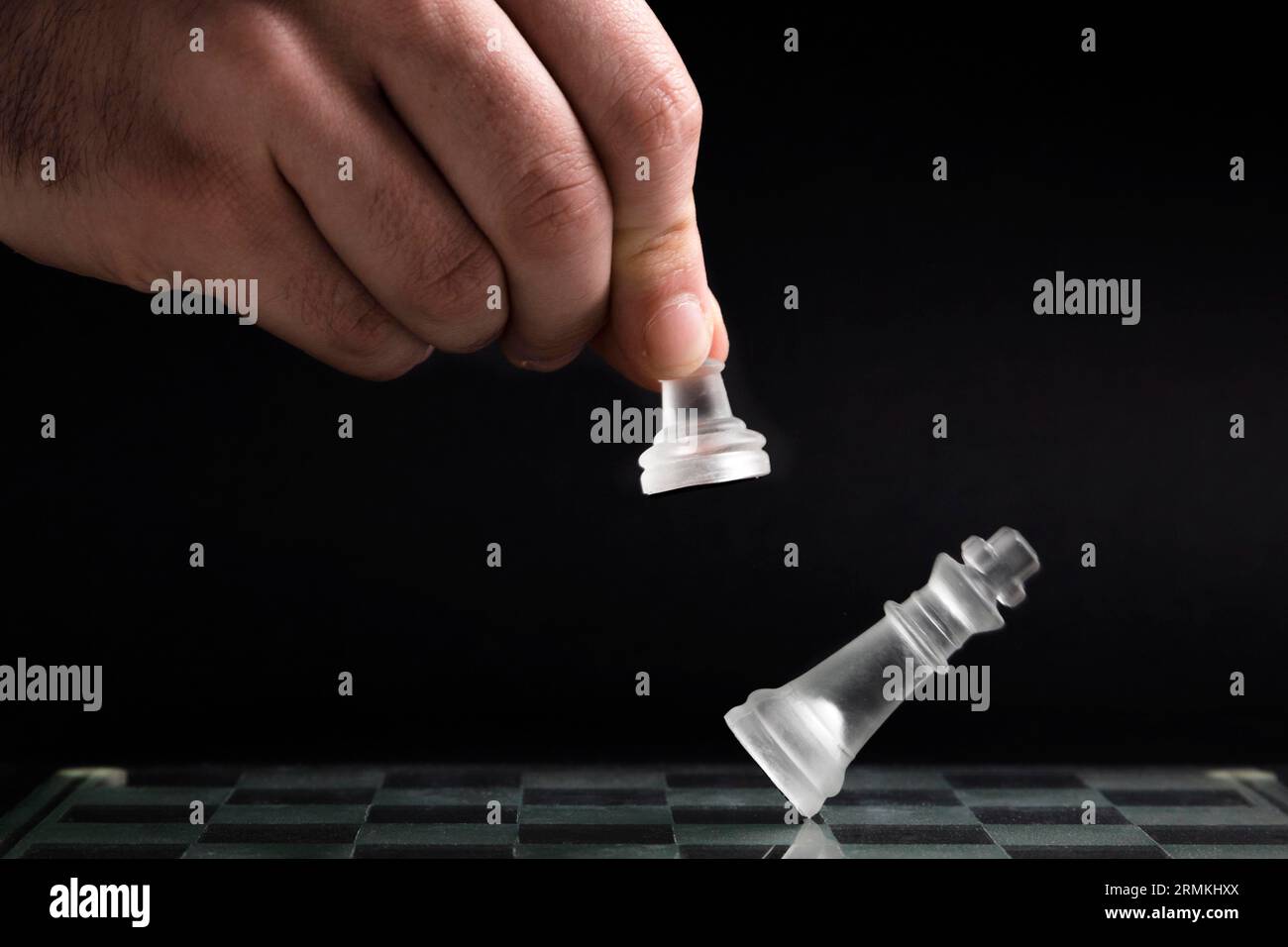 Hand moving transparent chess pieces Stock Photo - Alamy