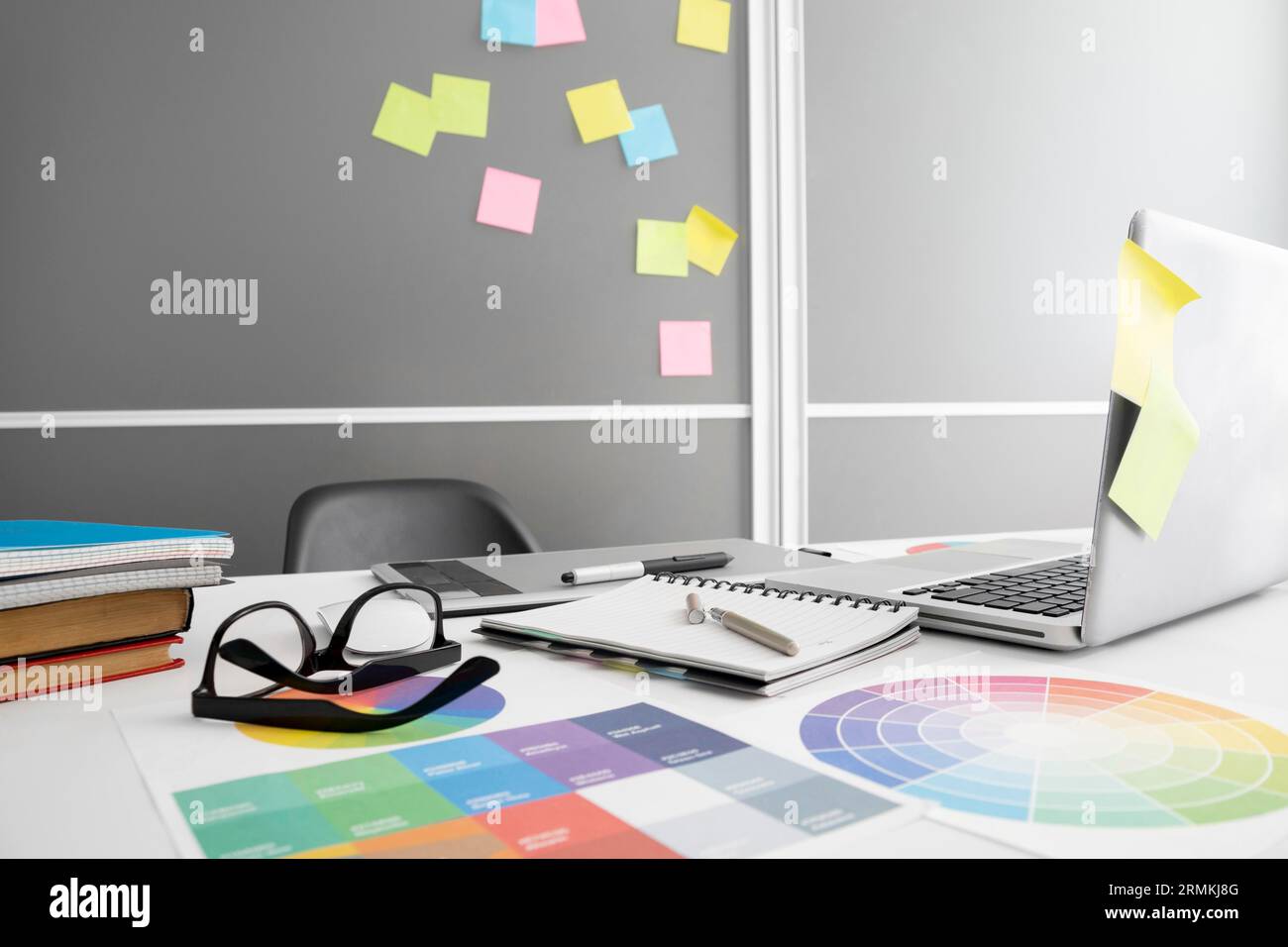 Laptop office desk with notebook chair Stock Photo - Alamy