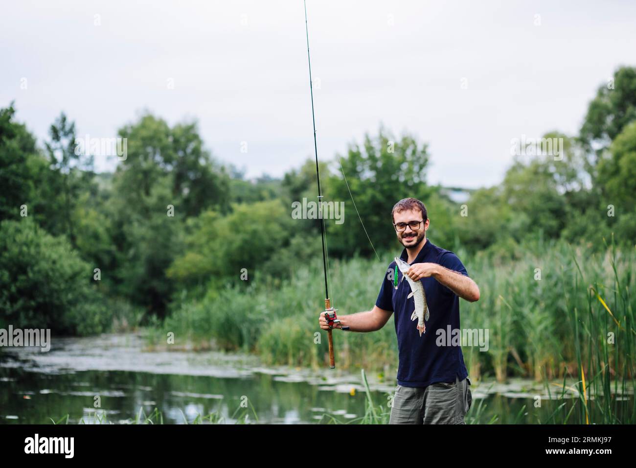 Rod with fish hi-res stock photography and images - Alamy