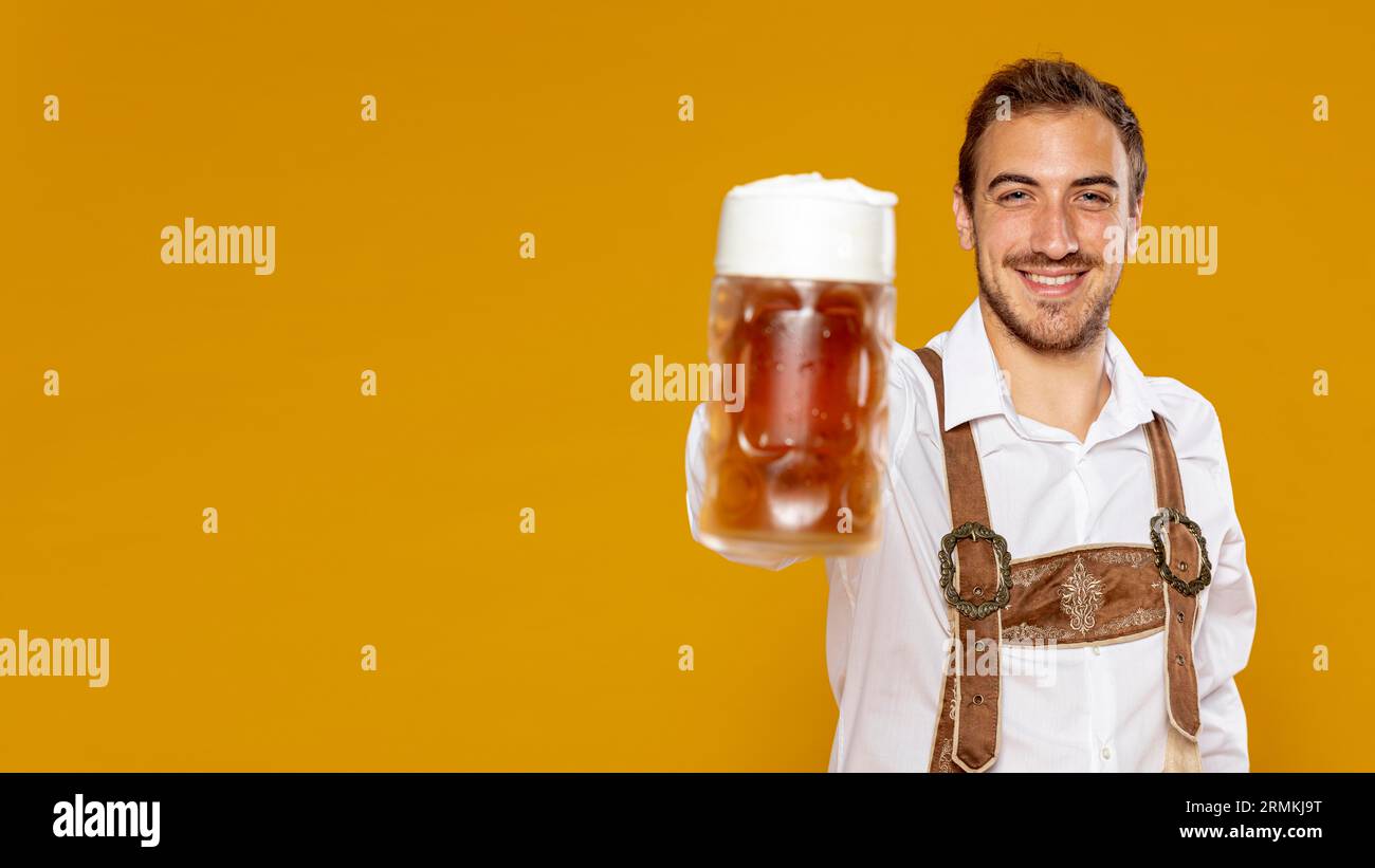 Man holding beer pint with copy space Stock Photo - Alamy Man holding beer pint with copy space Stock Photo - Alamy