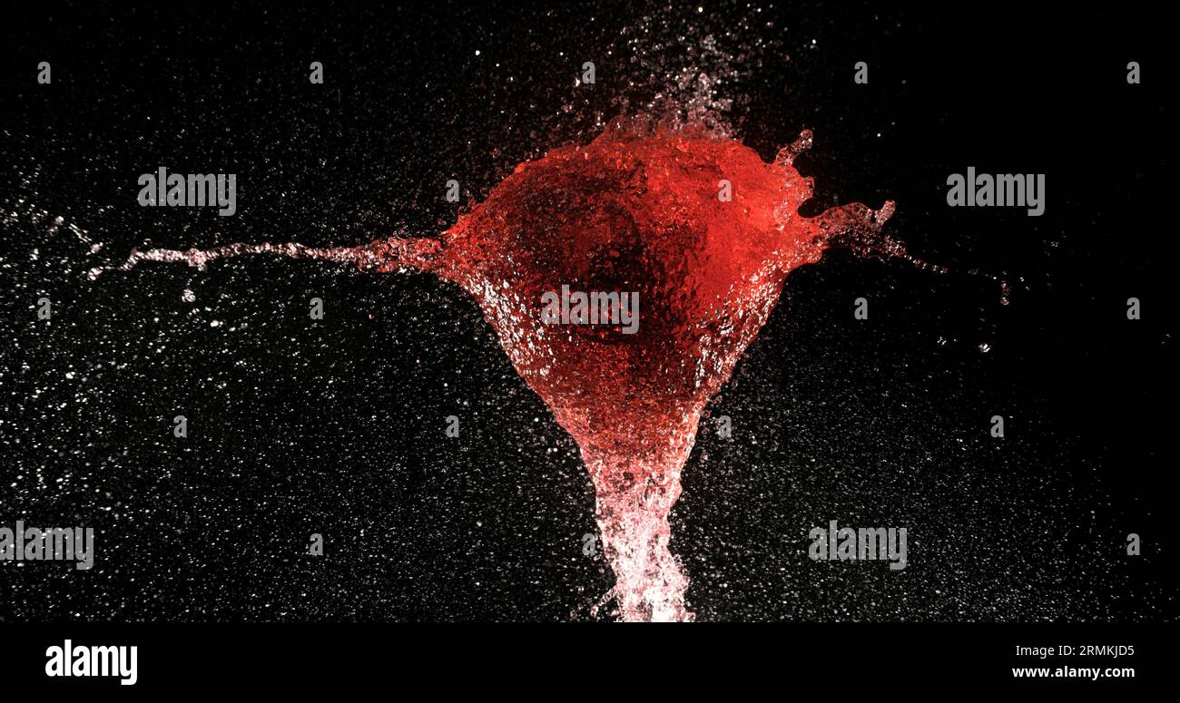 Shot Breaking Water Filled Red Balloon Stock Photo - Alamy