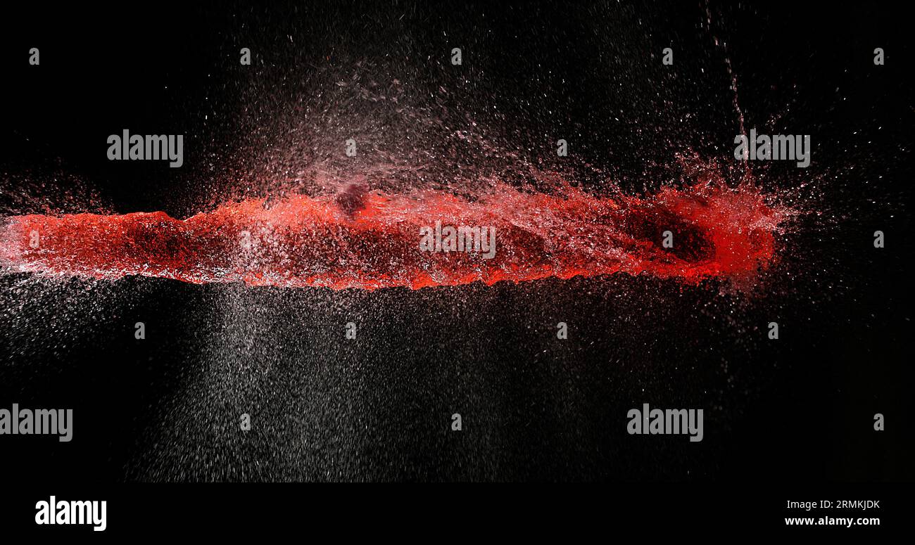 Shot breaking water filled red hi-res stock photography and images - Alamy