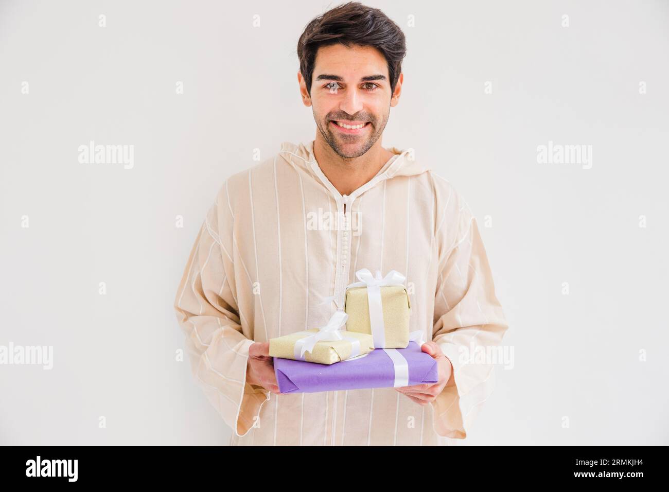 Muslim man holding gift box hi-res stock photography and images - Alamy
