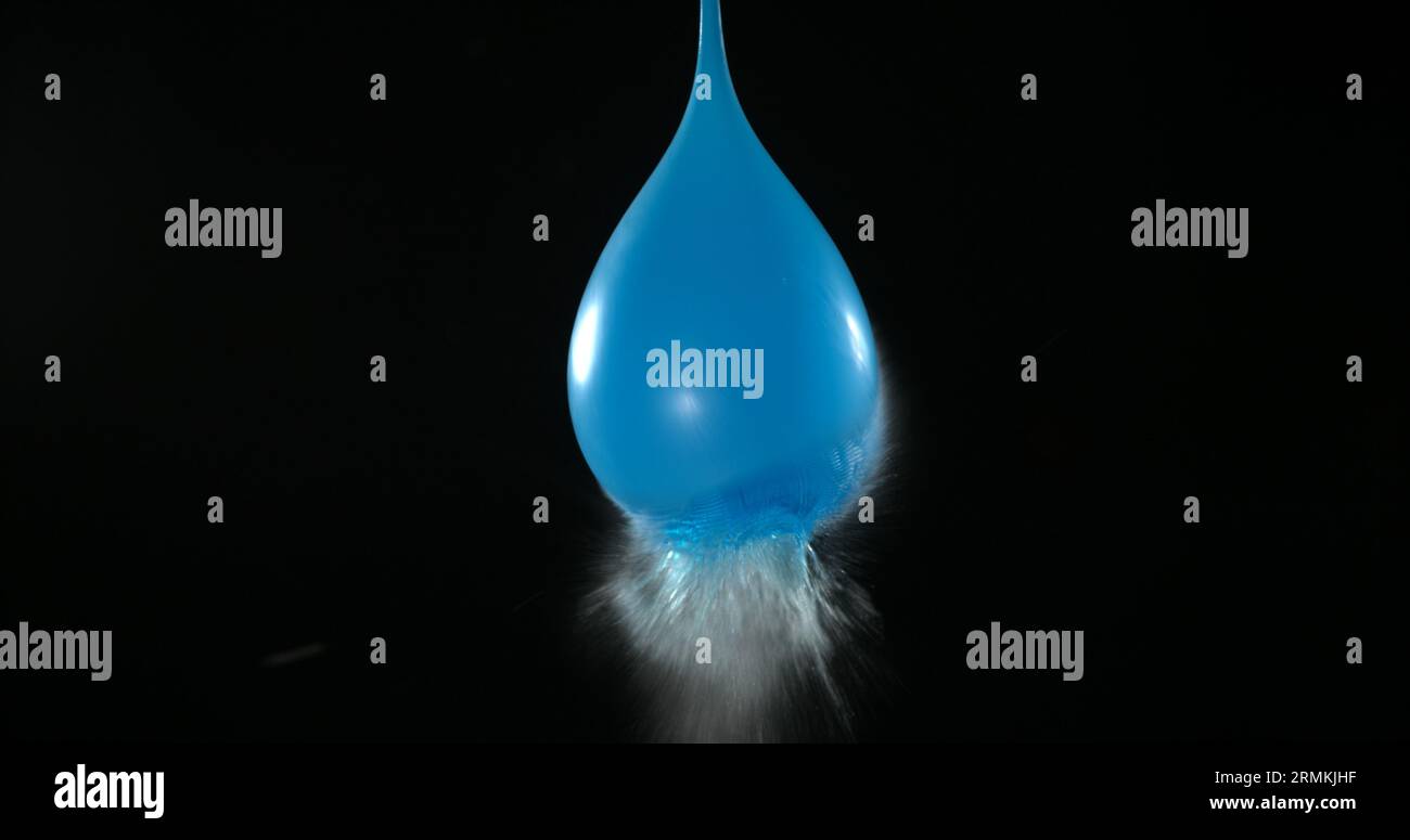 Shot Breaking Water Filled blue Balloon Stock Photo - Alamy