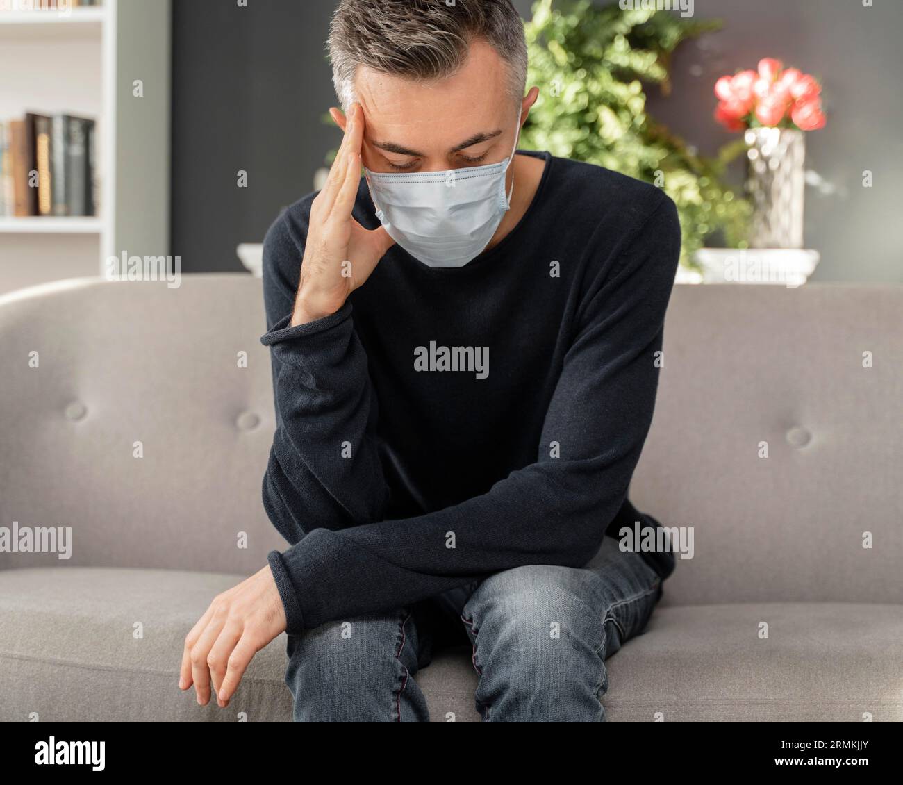 Mid shot worried man with mask therapy office Stock Photo - Alamy