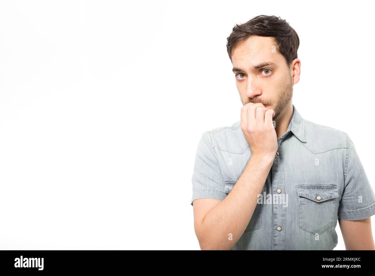 Nervous man looking camera Stock Photo - Alamy
