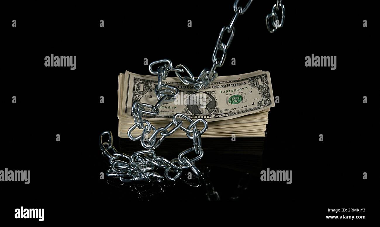 Chain Falling on Dollar Bank Notes against Black Background Stock Photo ...