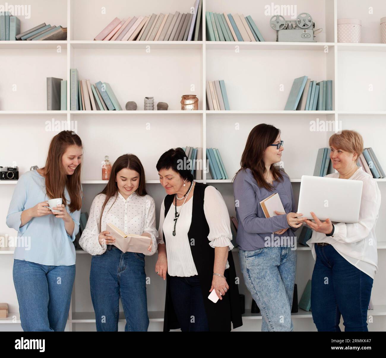 Social female gathering doing indoors activities Stock Photo - Alamy