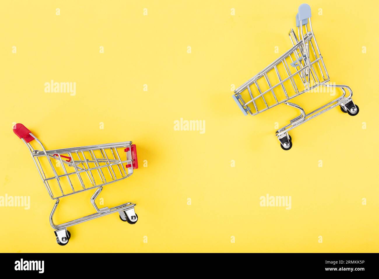 Shopping carts facing each other Stock Photo - Alamy