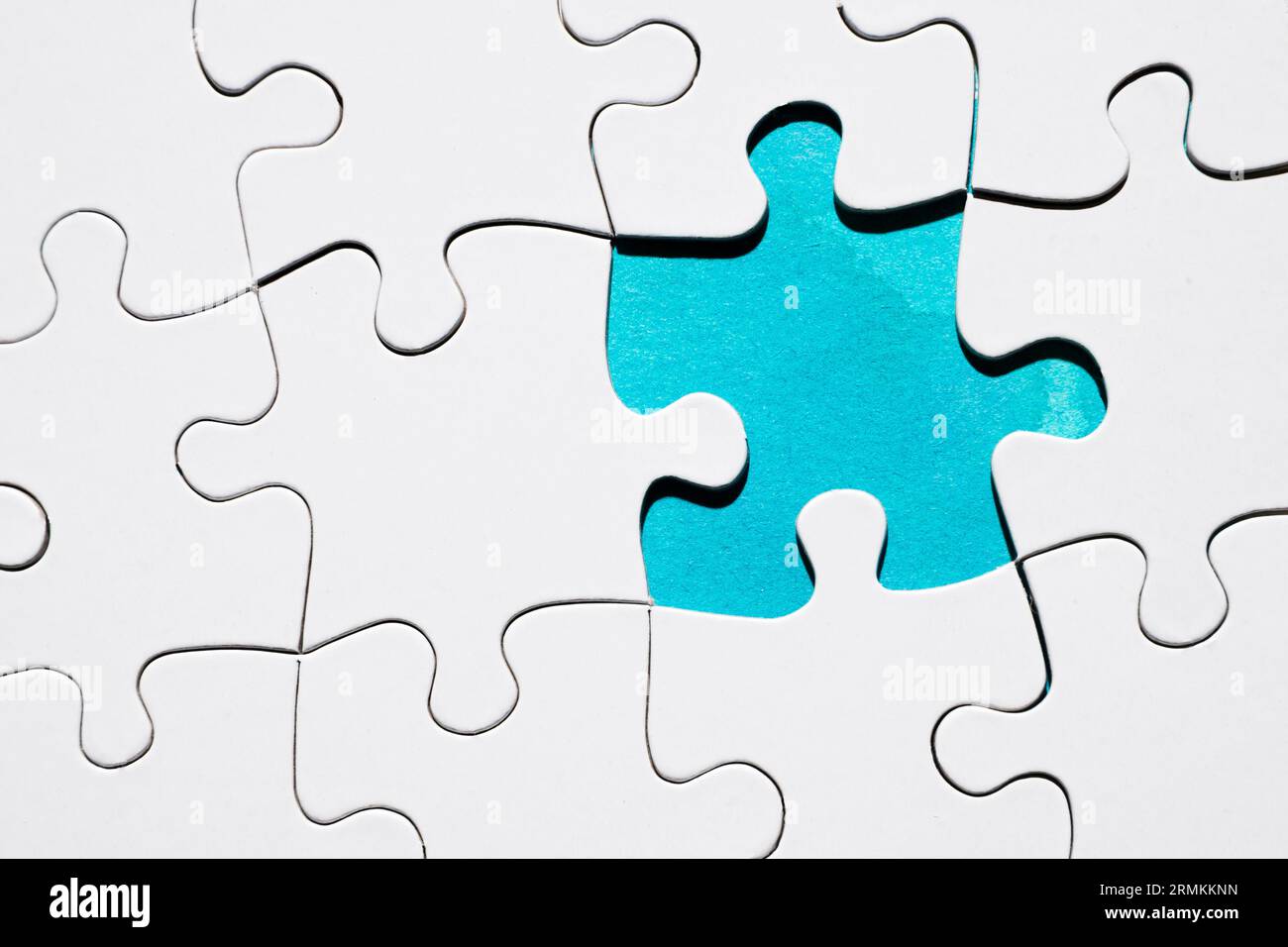 Top view missing puzzle piece puzzle grid backdrop Stock Photo - Alamy