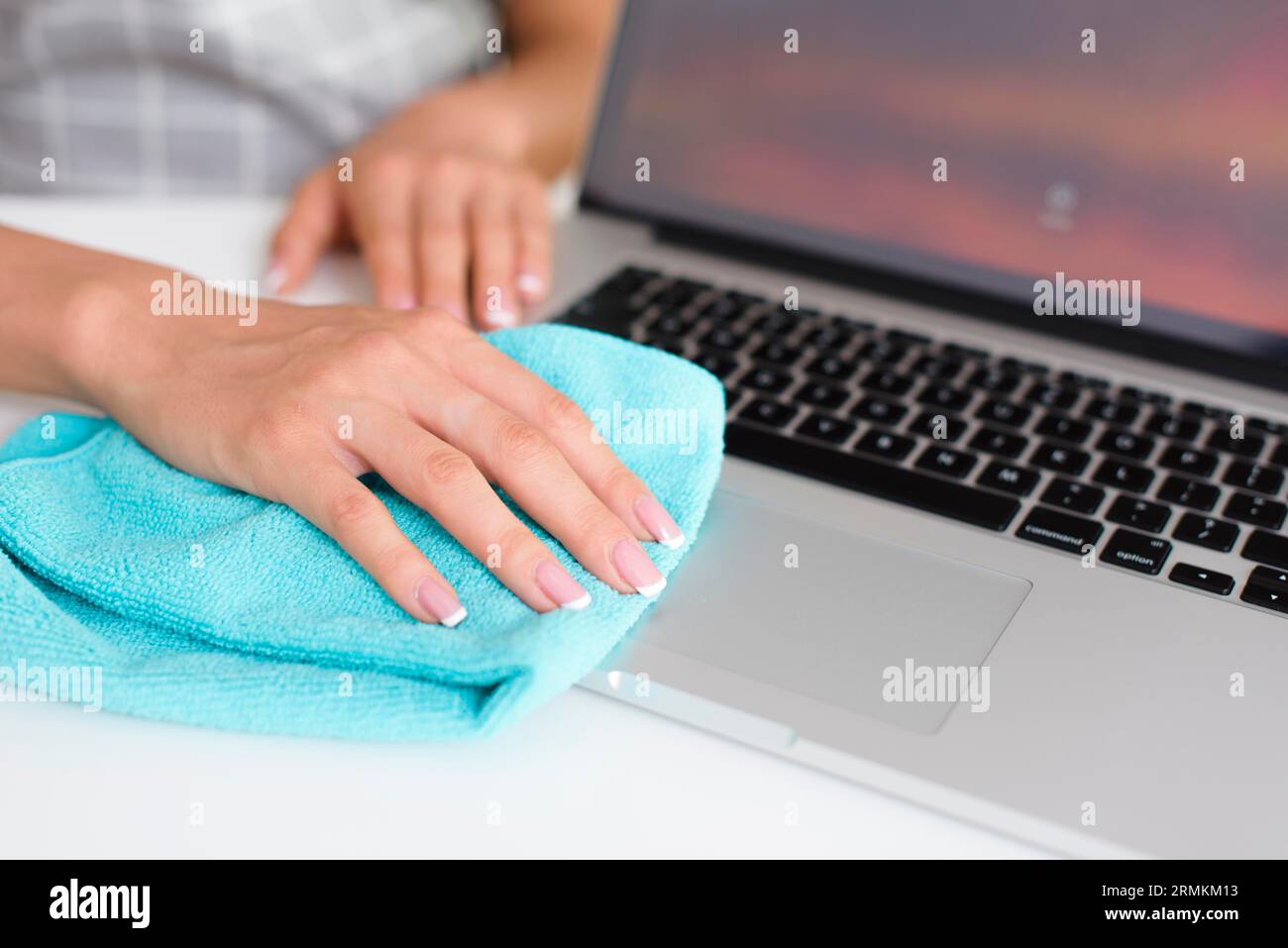 Woman hand cleaning laptop home Stock Photo - Alamy