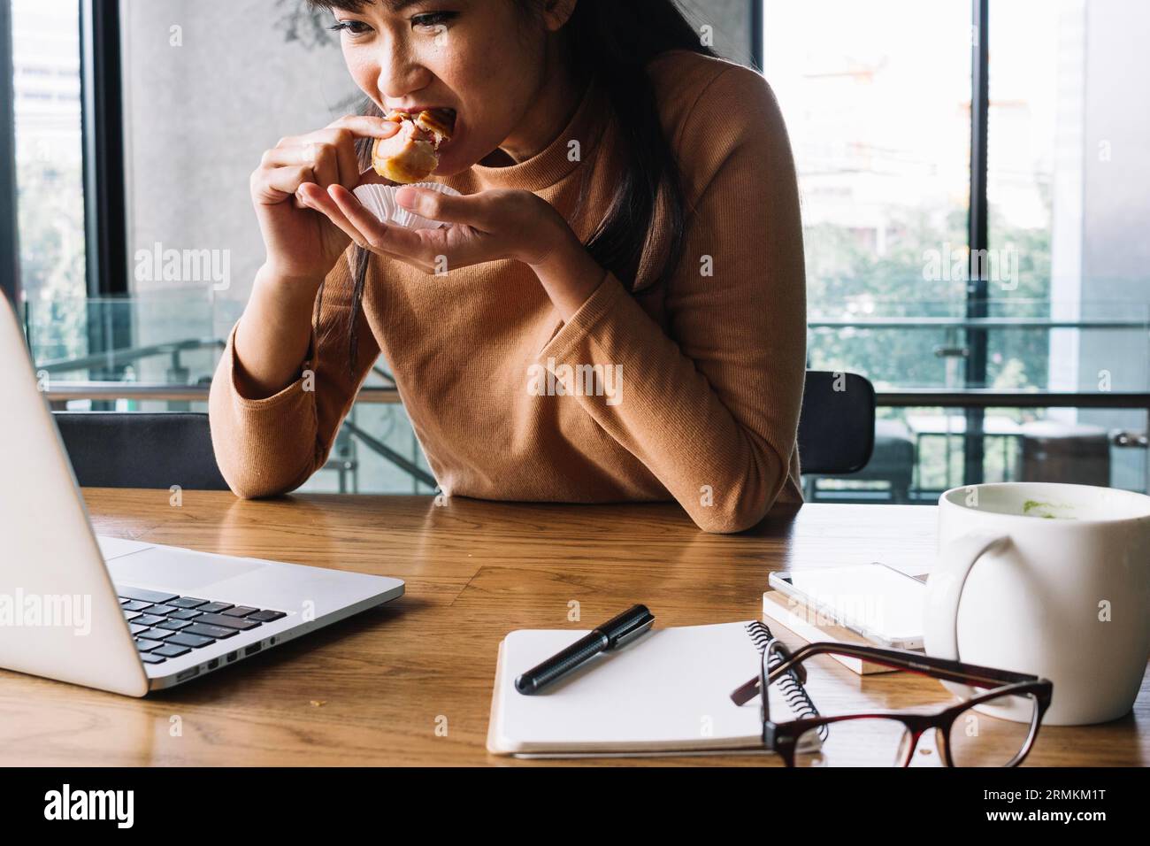 Unhealthy eating at desk hi-res stock photography and images - Alamy