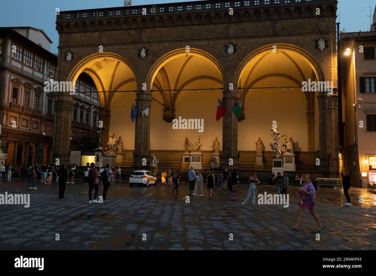 The illuminated wide arches of the Loggia del Lani are an open-air ...