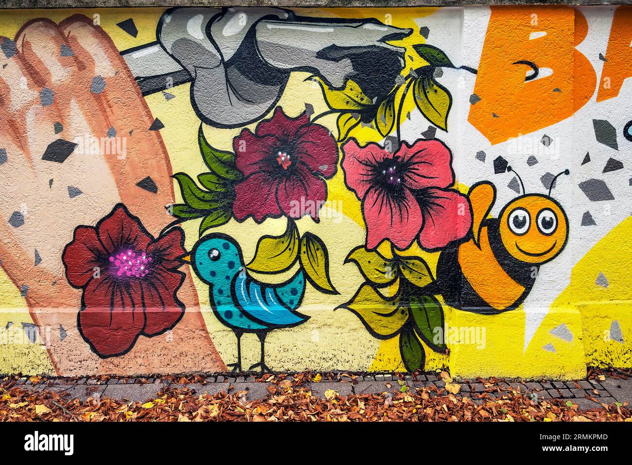 Graffiti on wall with flowers, bee and bird, Munich, Upper Bavaria ...