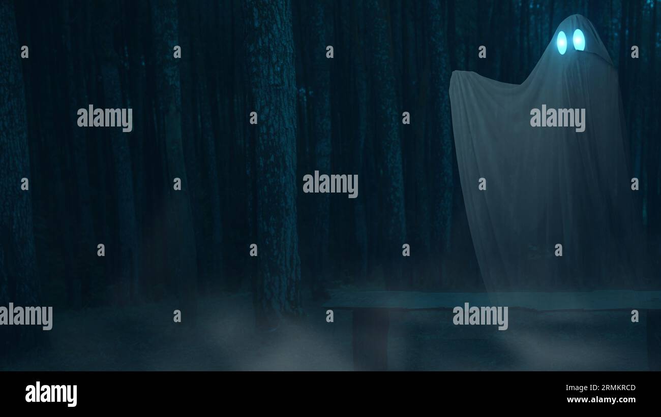 White ghost haunt on foggy forest in the night. Scary ghost Halloween ...