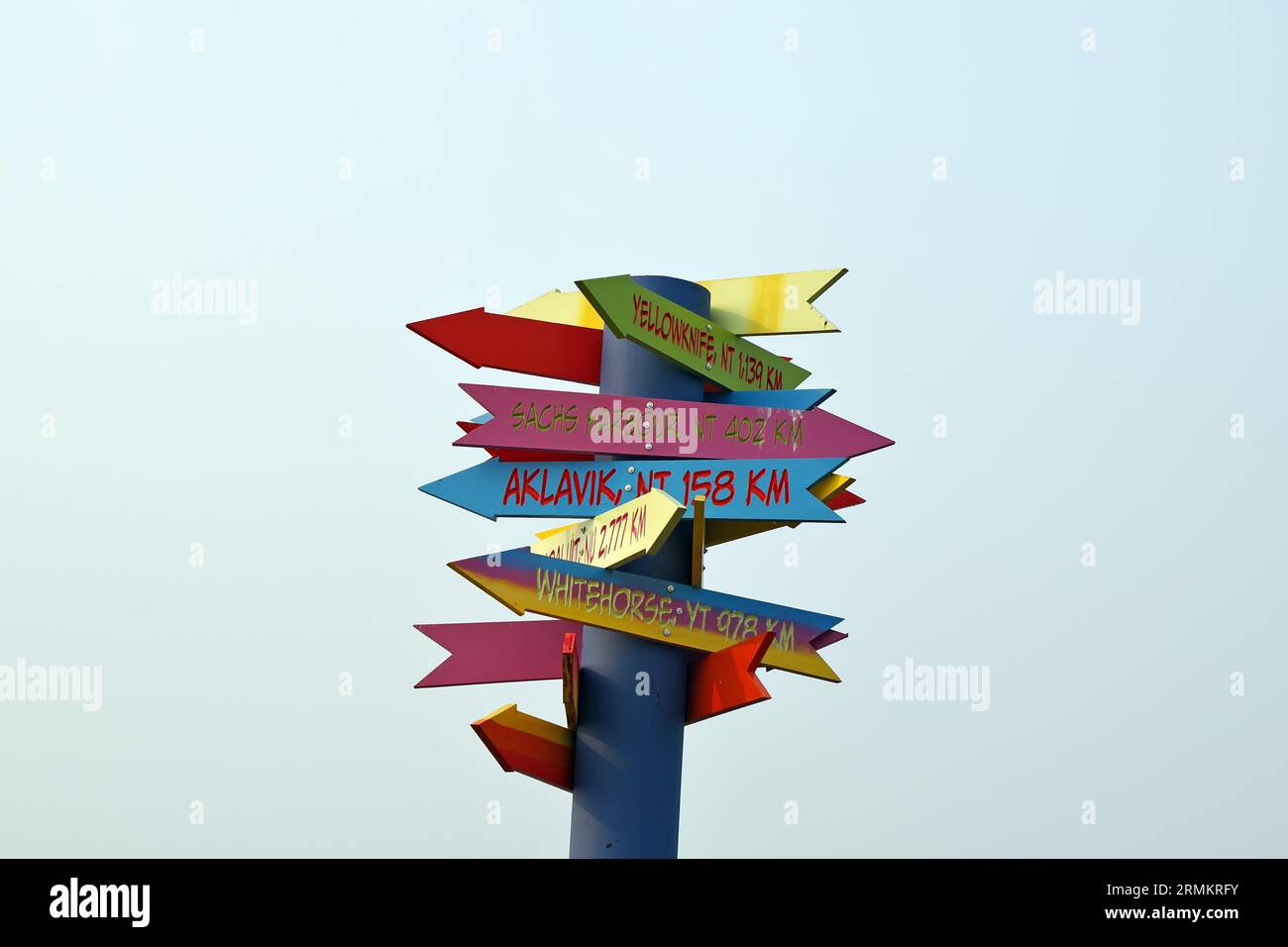 Colourful wooden signs with distance information, Whitehorse ...