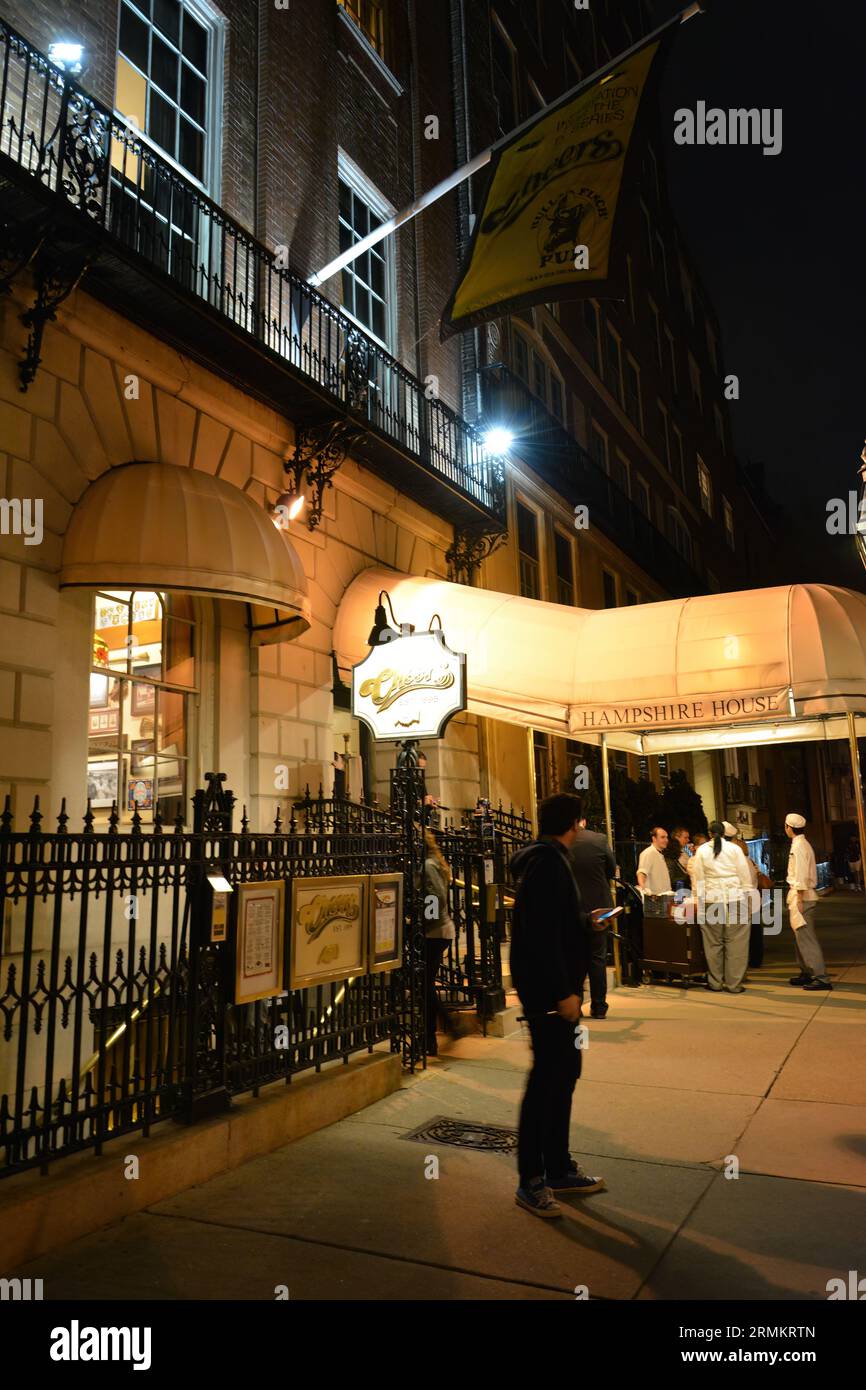 Night time photo of the famous Cheers bar on Beacon street, with people ...