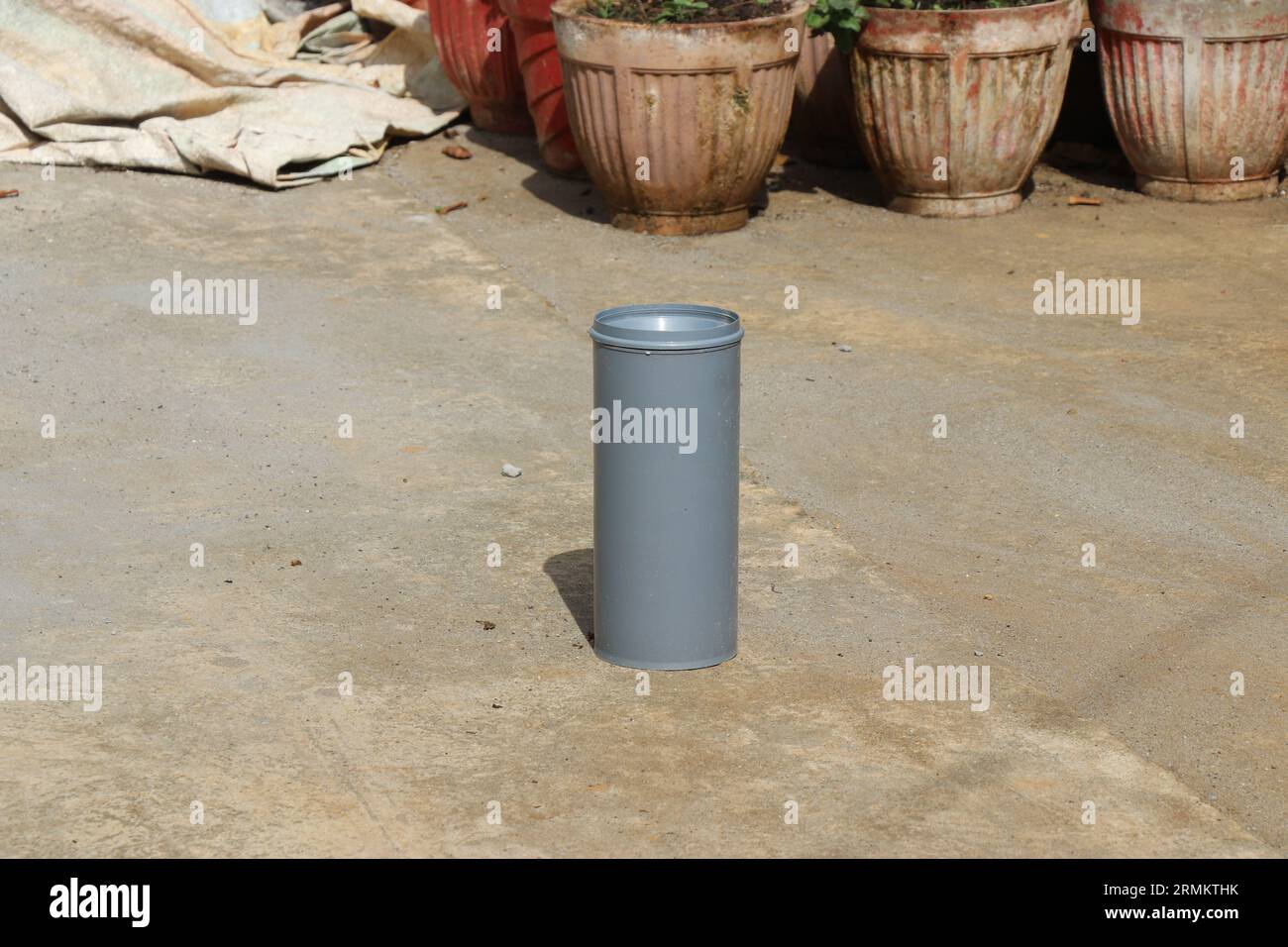 Rain gauge used to check the amount if rainfall kept on a concrete ...