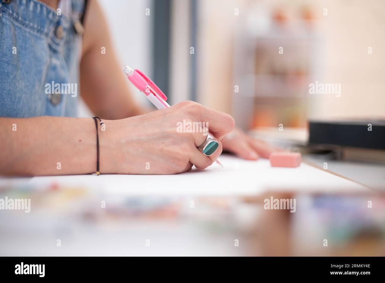 Illustrator hands drawing with pencil on paper. lateral vision and ...
