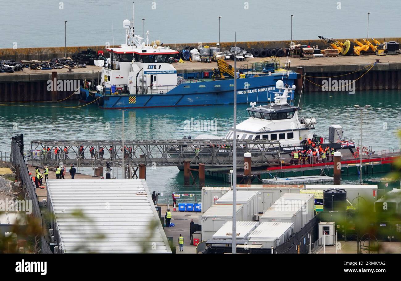 A group of people thought to be migrants arrive in Dover, Kent, onboard ...